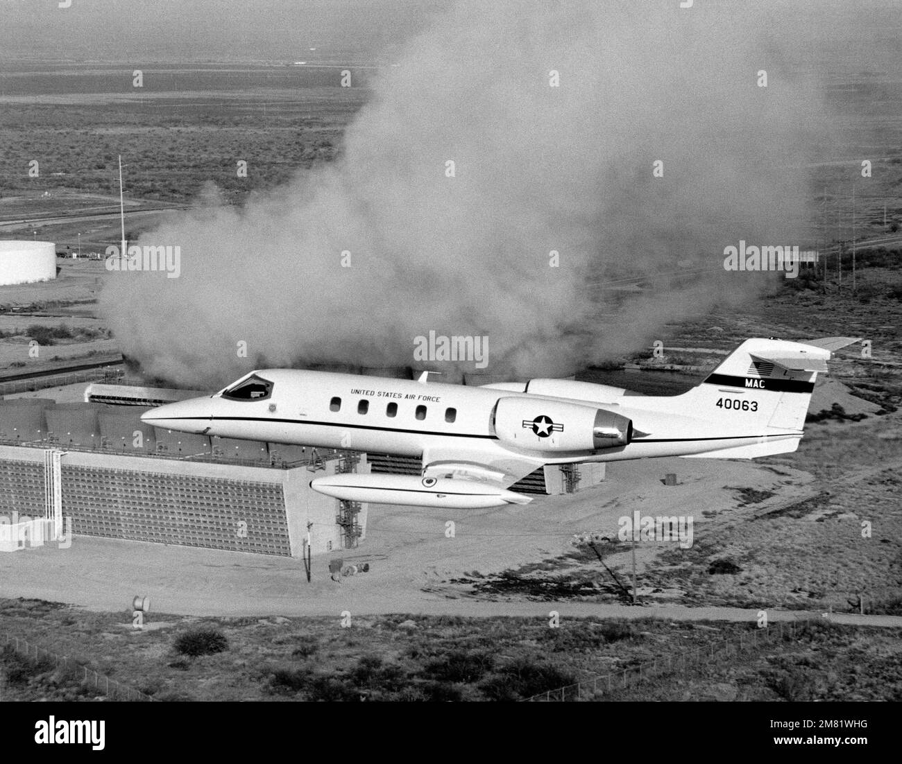 An air-to-air left side view of a Military Airlift Command C-21A ...
