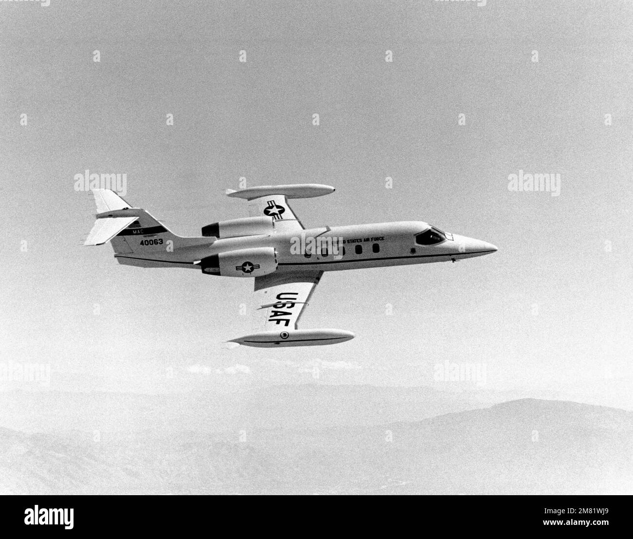 An air-to-air right side view of a Military Airlift Command C-21A ...