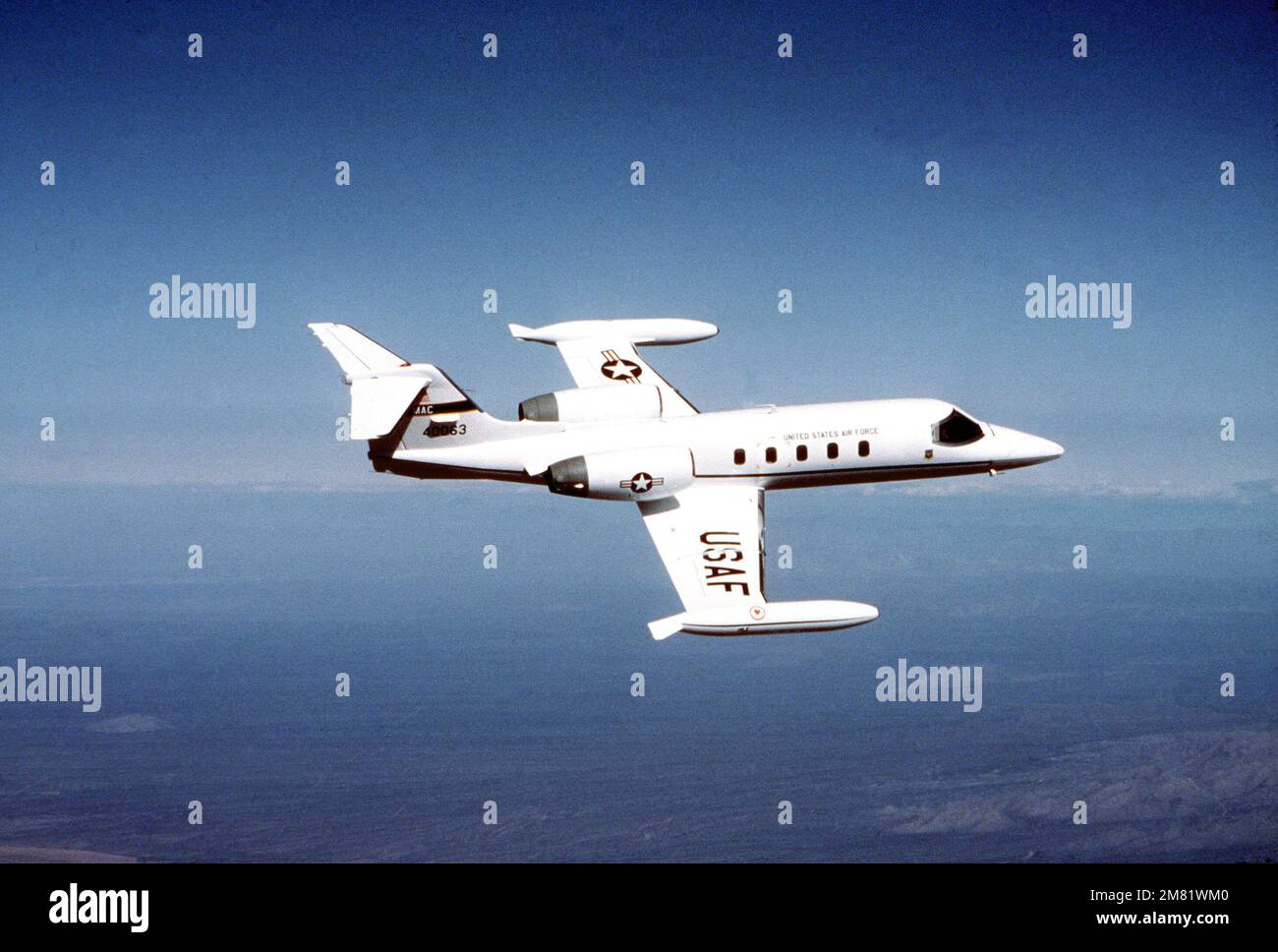 An air-to-air right side view of a C-21A operational support aircraft ...
