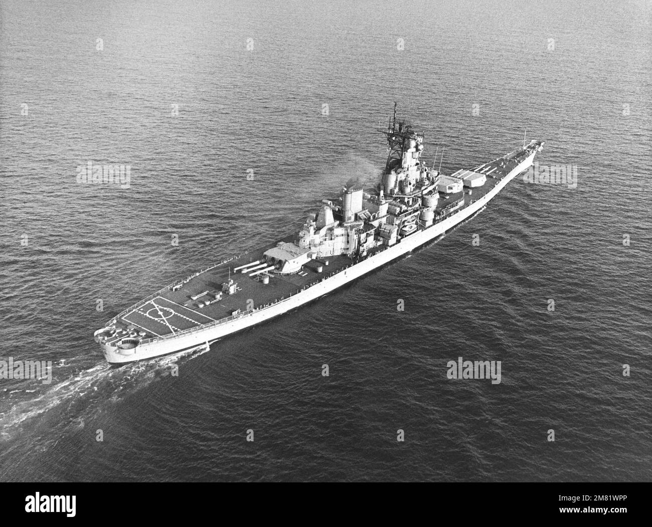 An elevated starboard quarter view of the battleship USS IOWA (BB 61) underway during sea trials ...