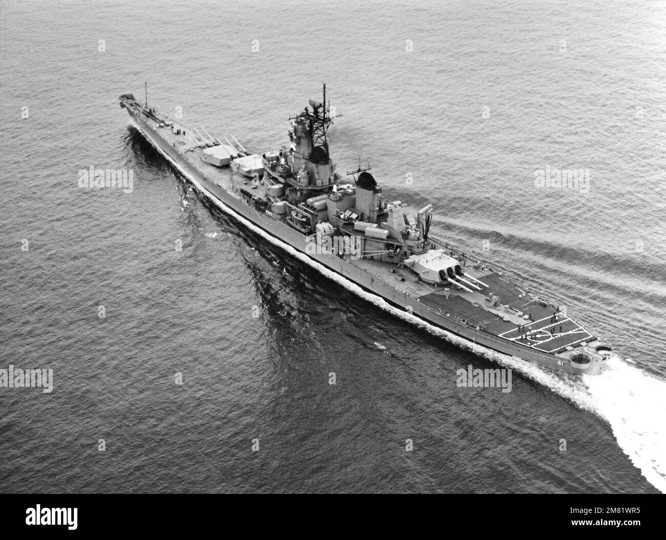 An elevated port quarter view of the battleship USS IOWA (BB 61) underway during sea trials ...
