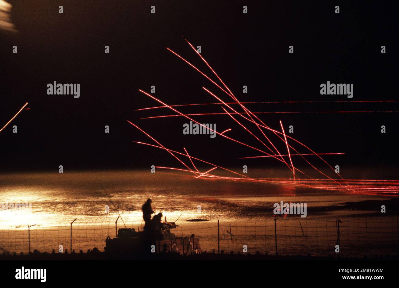Tracer rounds light up the sky as a nighttime live-fire exercise takes ...