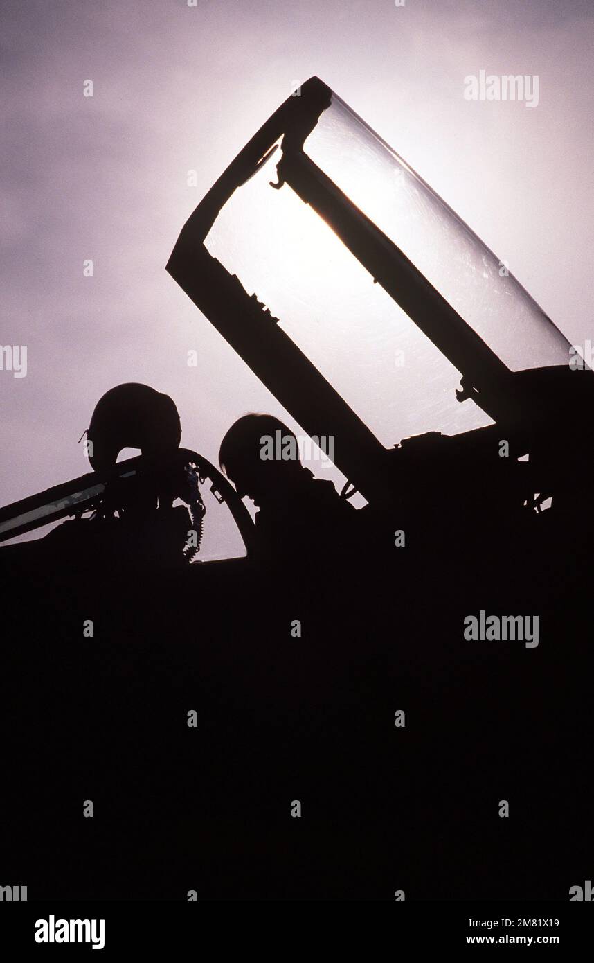 Major Mike Maron, 3rd Tactical Fighter Wing, is silhouetted against the ...