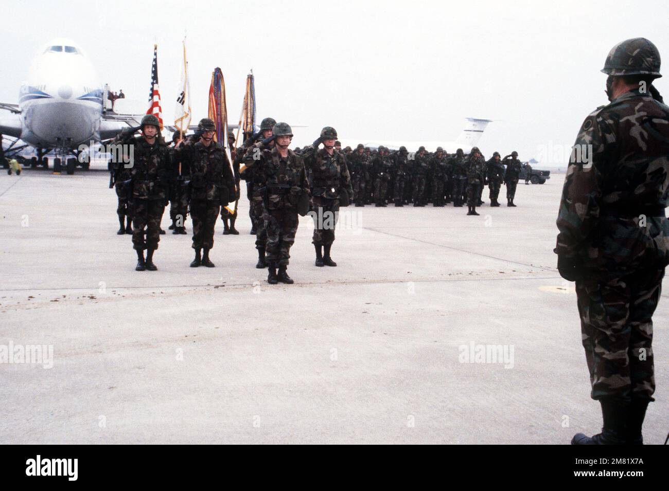 Lieutenant General John Brandenburg returns a salute to soldiers ...