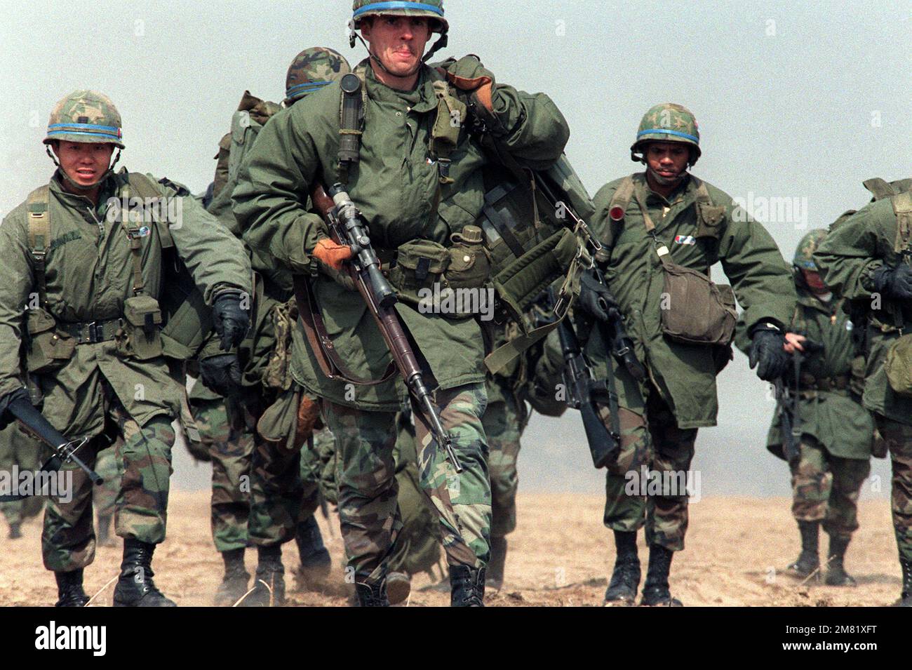 U.S. troops, wearing cold weather gear, participate in the joint South ...