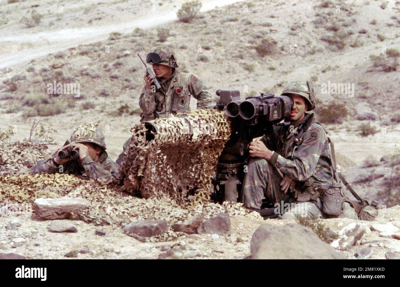 Infantrymen prepare to fire a tube-launched, optically-tracked, wire ...
