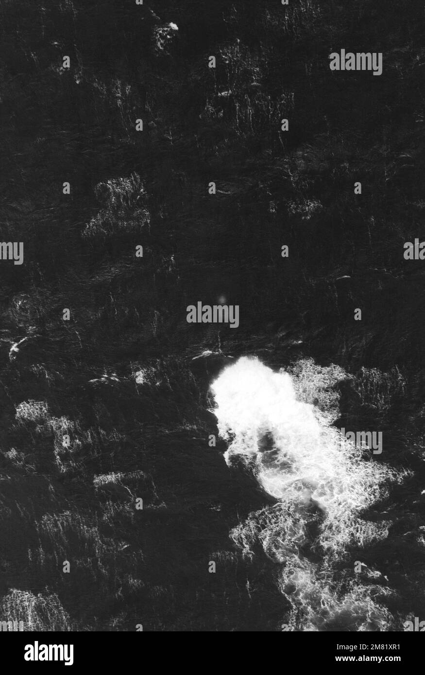 An aerial view of a Soviet "Victor I" class submarine submerged just ...