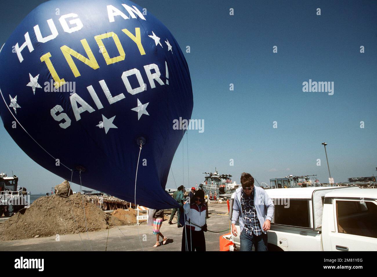 A large balloon is inflated to welcome crew members of the aircraft ...