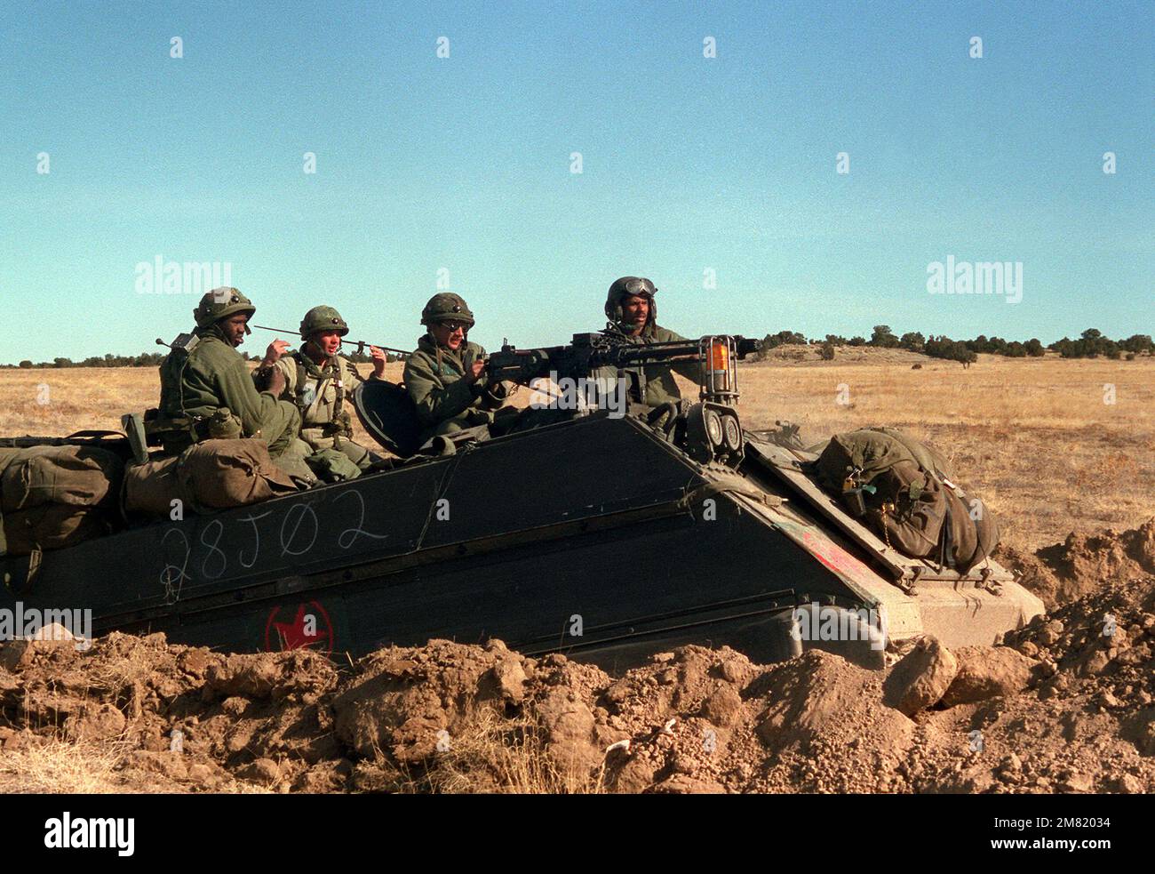 Members of Co. D, 1/22 Armor, man an M-113 armored personnel carrier ...