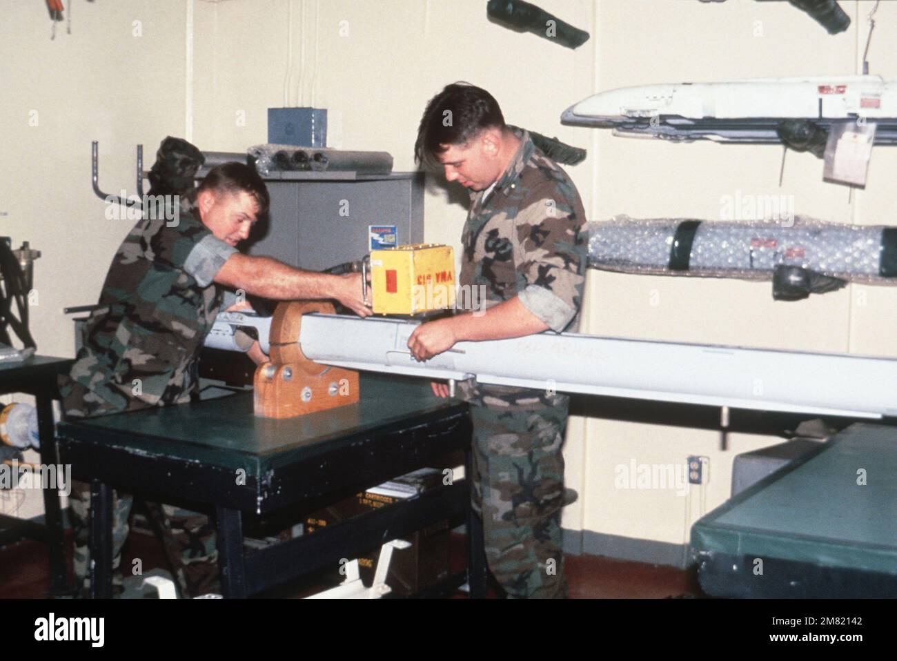 Two members of the Aircraft Intermediate Maintenance Department (AIMD ...