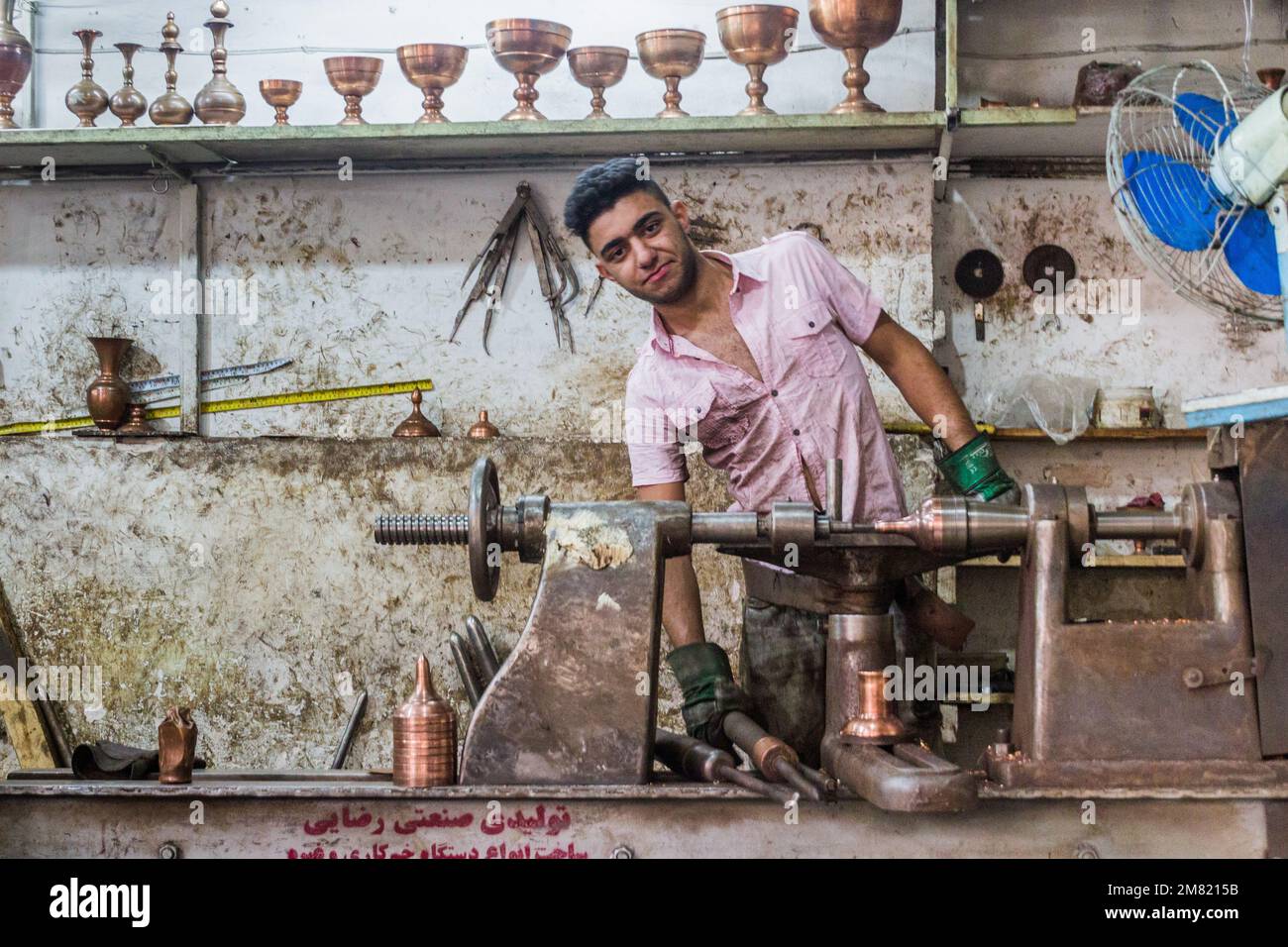 ISFAHAN, IRAN - JULY 10, 2019: Metal worker at the bazaar (market) in ...
