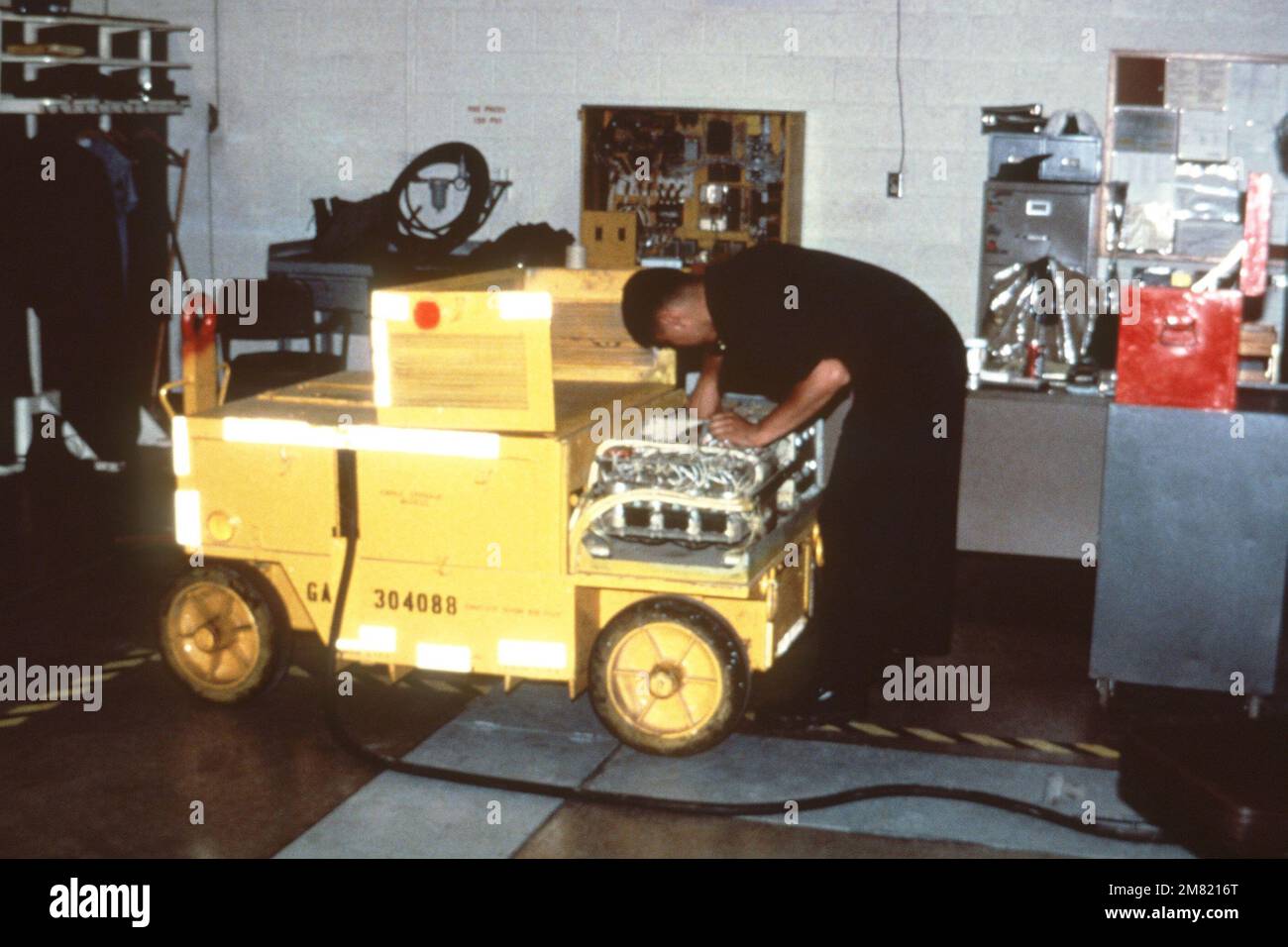 A member of the Aircraft Intermediate Maintenance Department (AIMD ...