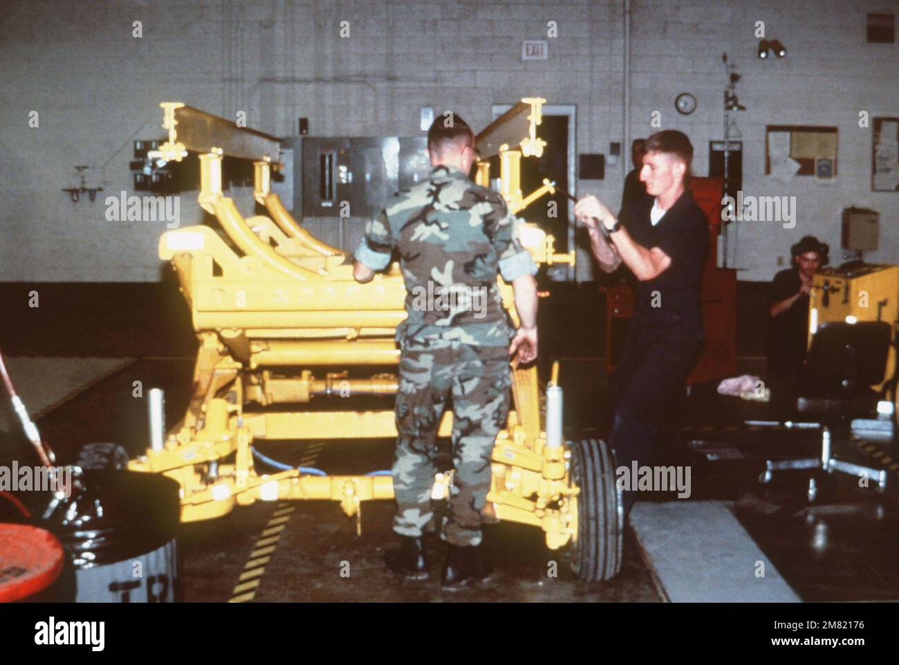 A member of the Aircraft Intermediate Maintenance Department (AIMD ...