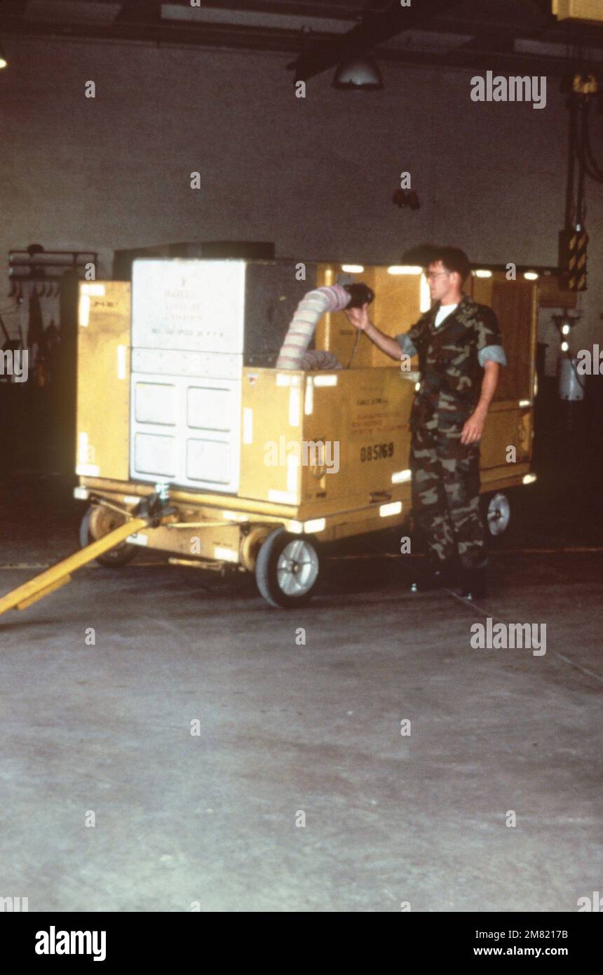 A member of the Aircraft Intermediate Maintenance Department (AIMD ...