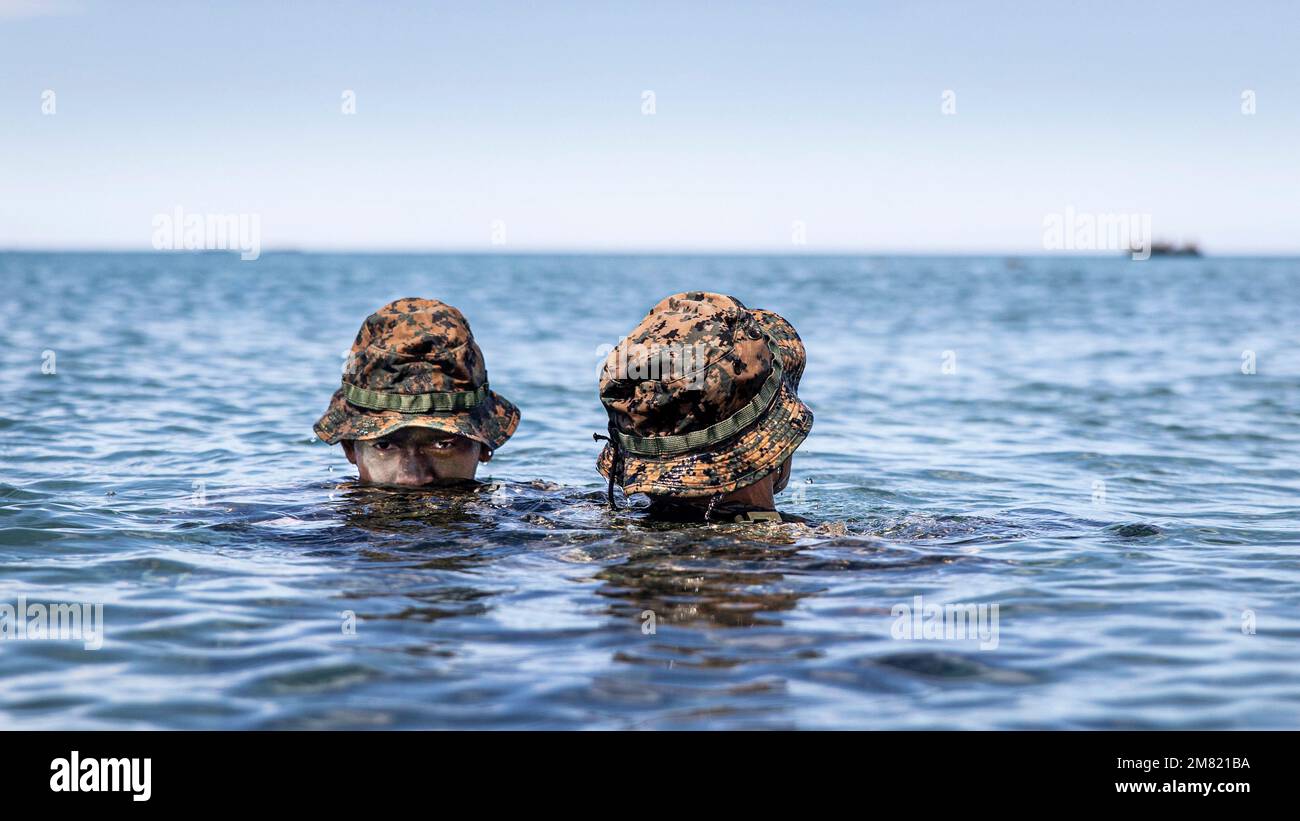 U.S. Marine Corps Lance Cpl. Kody Morgan, left, swims ashore as Cpl ...