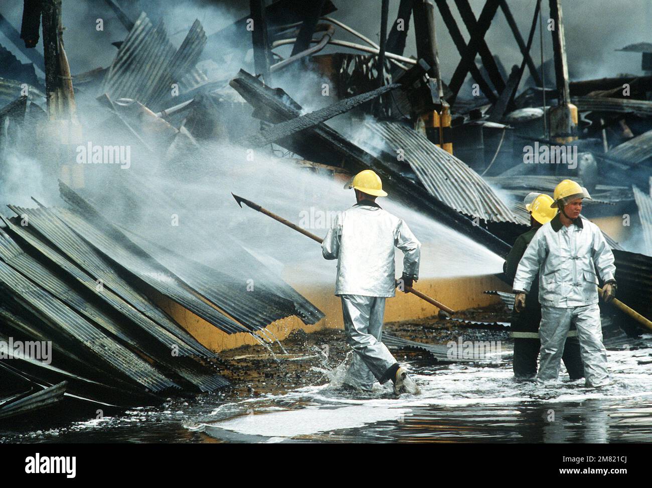 A firefighter from the 3rd Civil Engineering Squadron uses a pike/pull ...