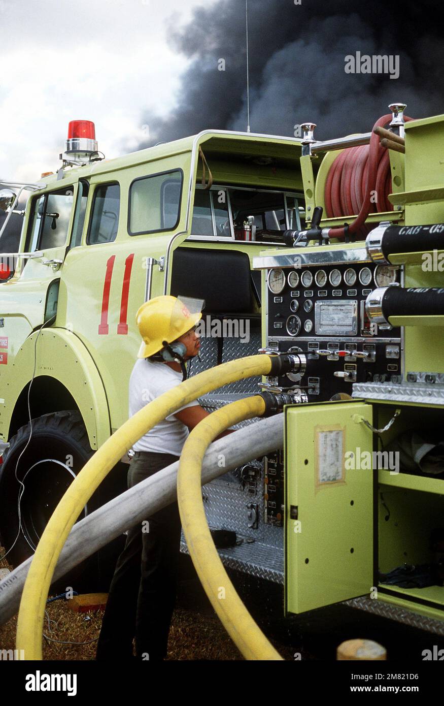 A firefighter from the 3rd Civil Engineering Squadron sets up the ...