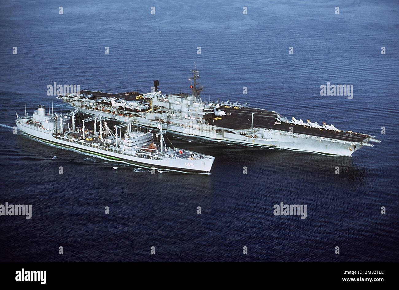 A starboard bow view of the oiler USNS HASSAYAMPA (T-AO 145) refueling ...