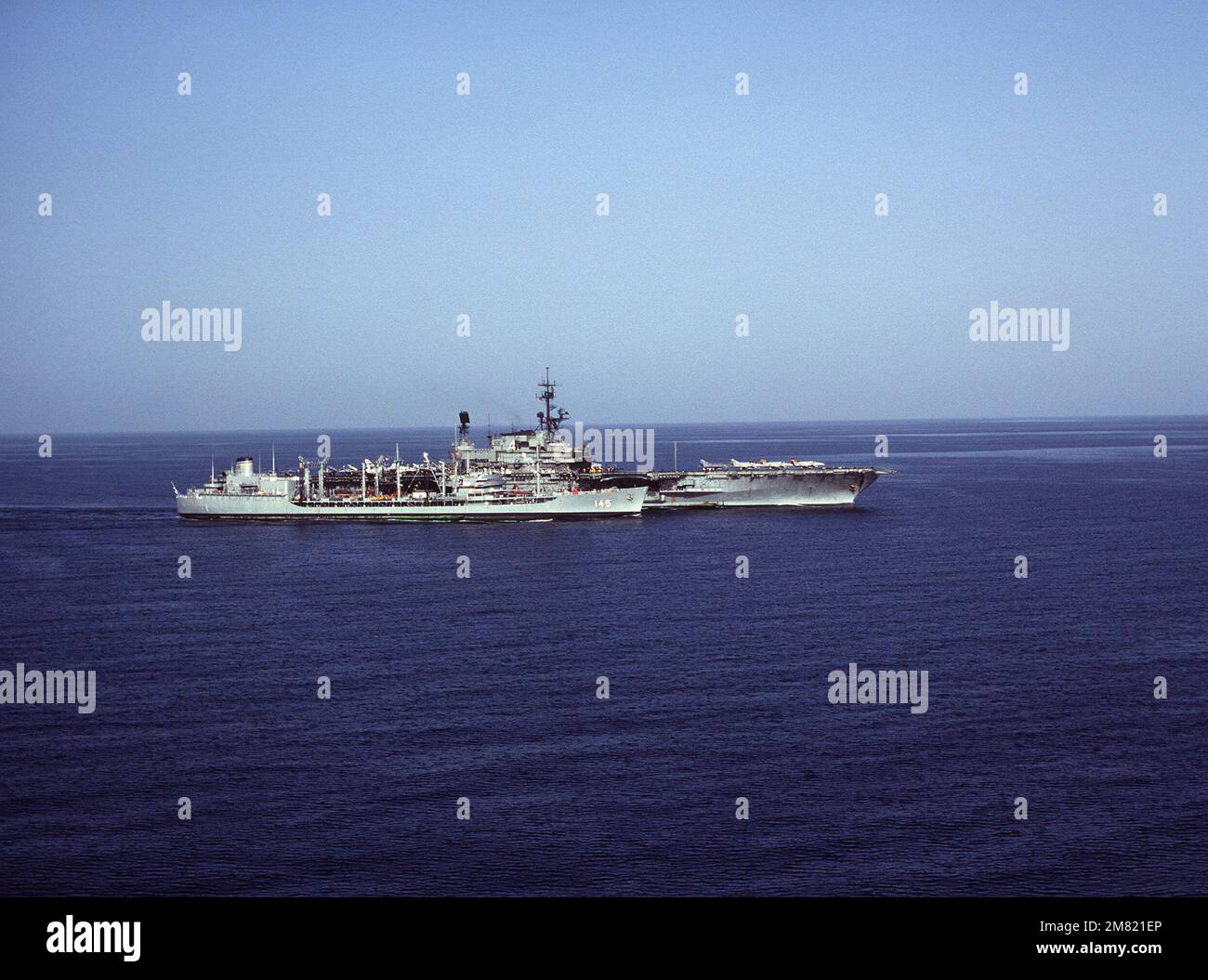 A starboard bow view of the oiler USNS HASSAYAMPA (T-AO 145) refueling ...