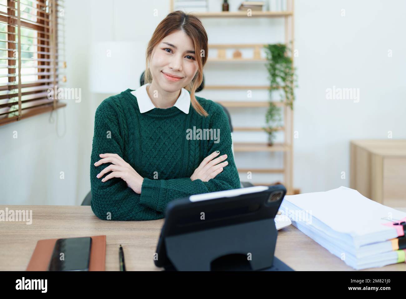 Portrait of a woman business owner showing a happy smiling face as he ...