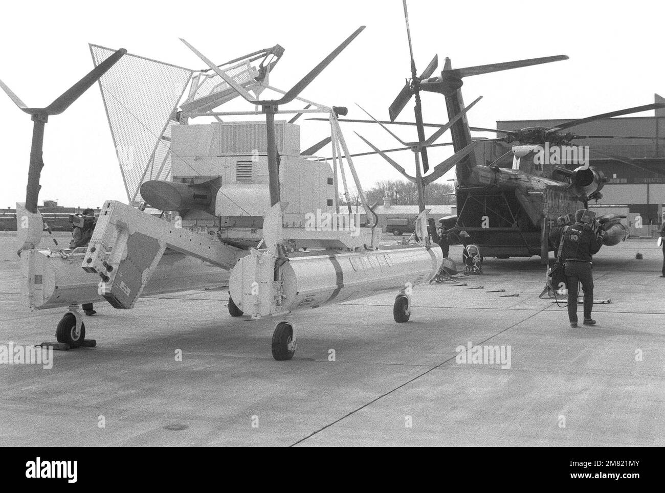 Cameramen record activities taking place on the flight line as an RH ...