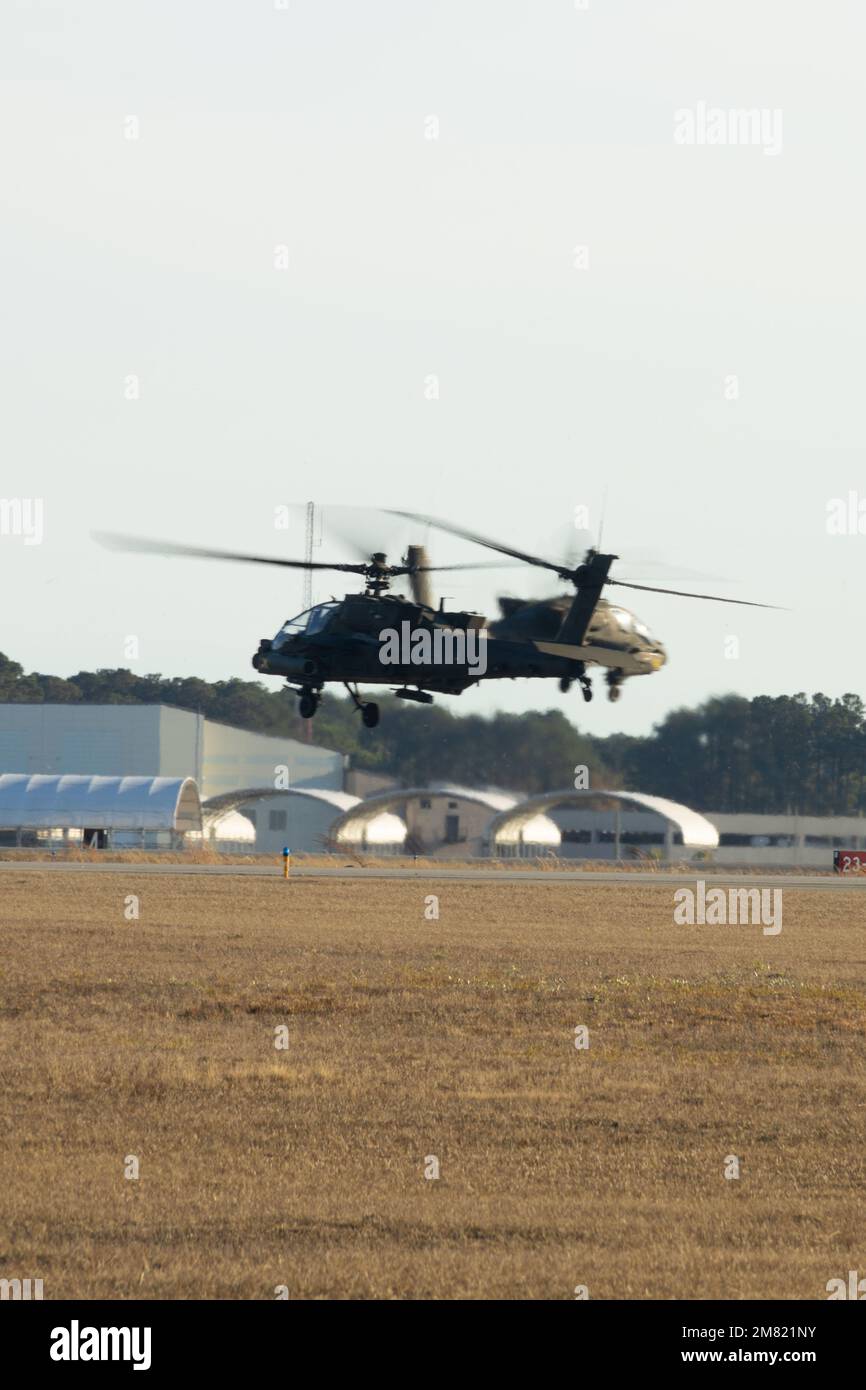 U.S. Army AH-64 Apaches takes off after refueling on Marine Corps Air ...