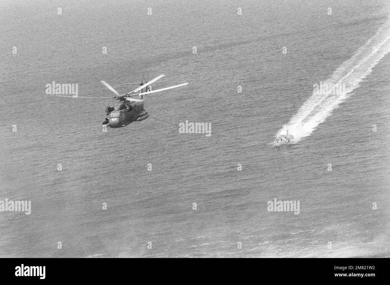 An air-to-air left front view of an RH-53D Sea Stallion helicopter ...
