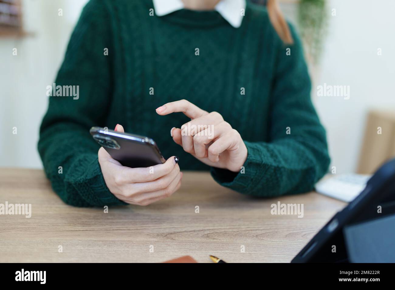 business owner or Asian male marketers are using smart phone and tablet ...