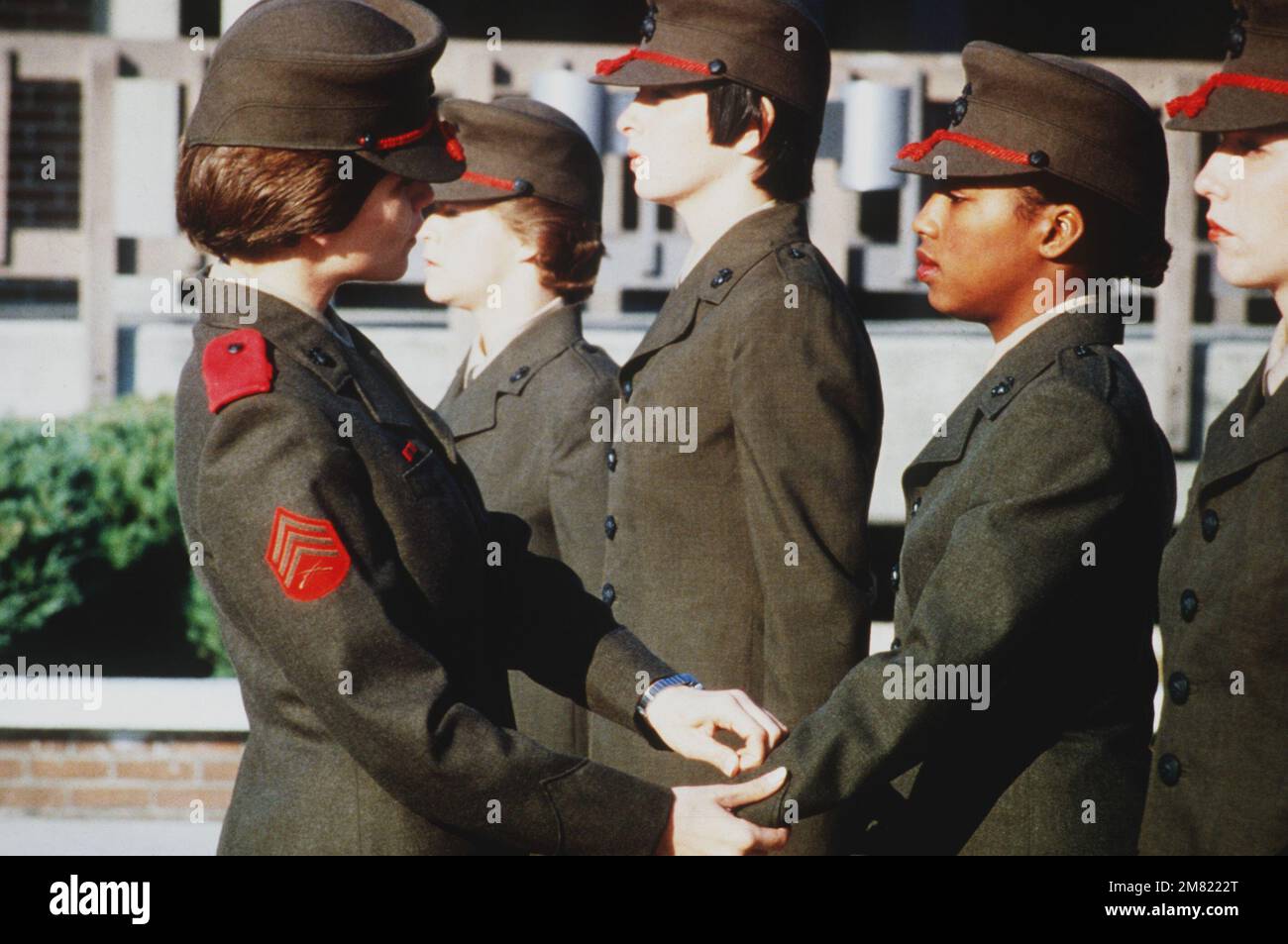 A drill instructor from the Woman Recruit Training Command conducts a ...
