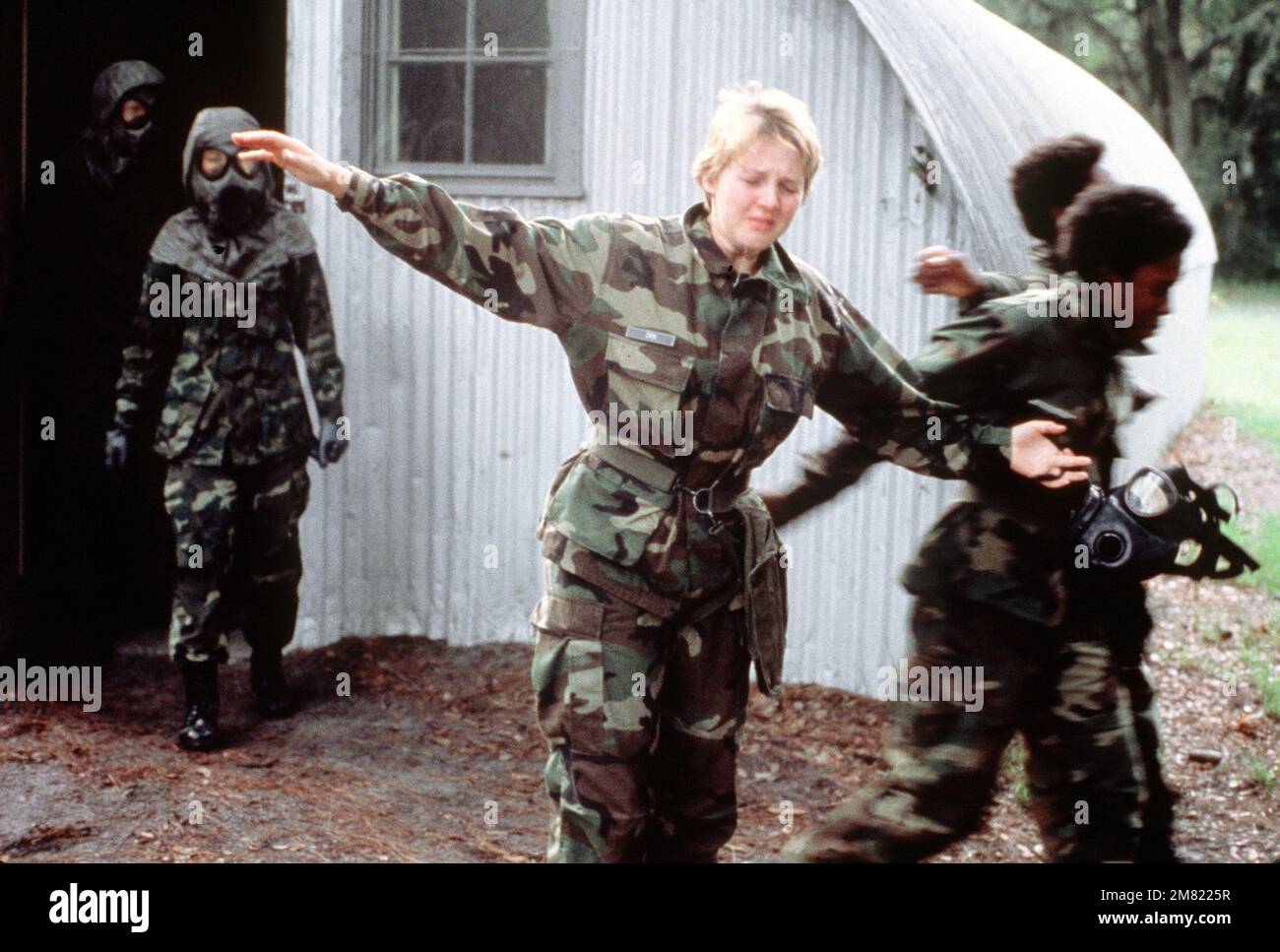 Recruits from the Woman Recruit Training Command exit from a gas ...