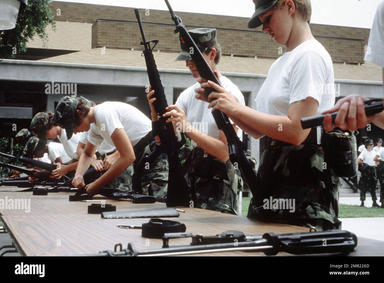 Recruits from the Woman Recruit Training Command learn to field strip ...