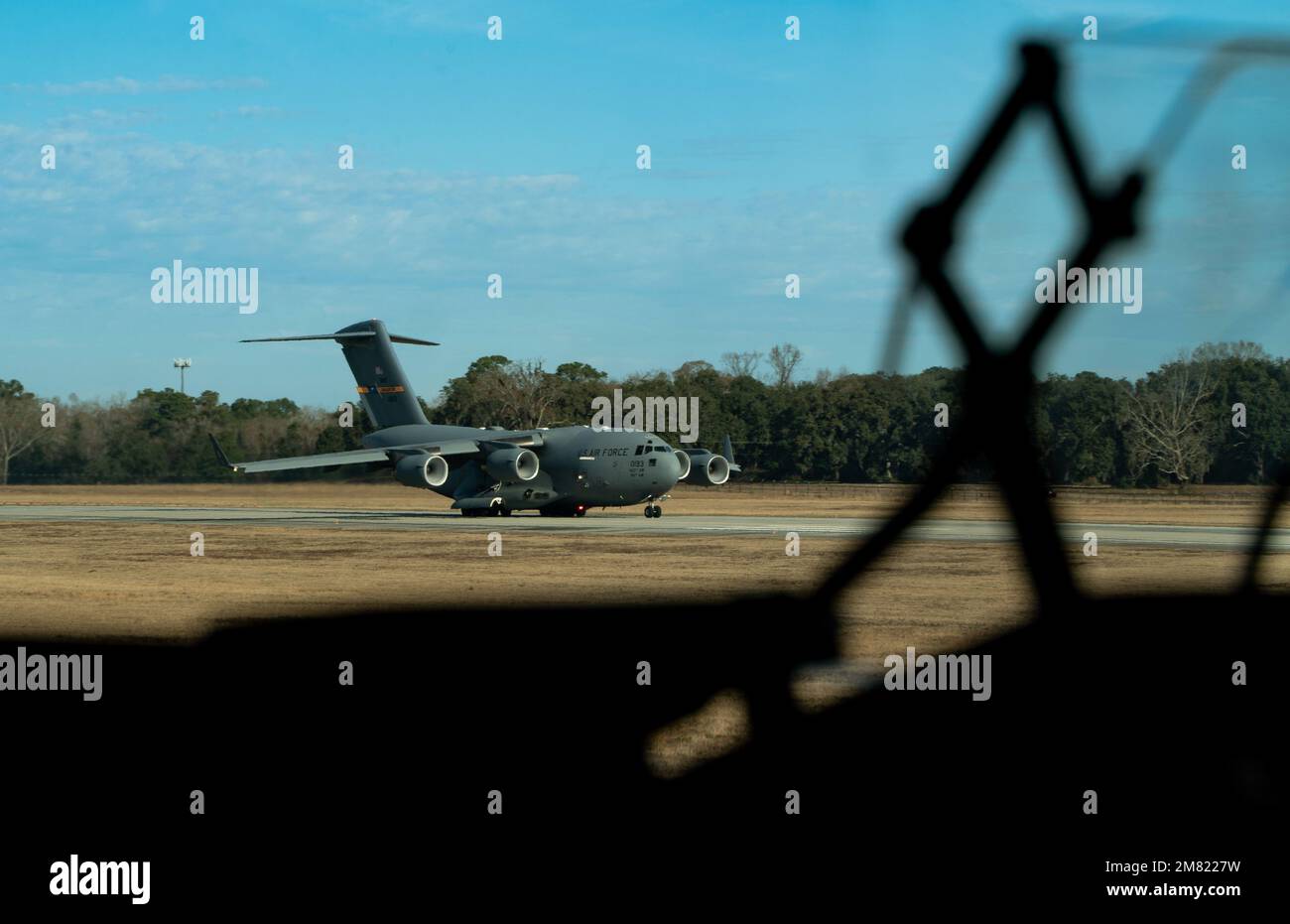 A 437th Airlift Wing C-17 Globemaster III begins takeoff procedures as ...