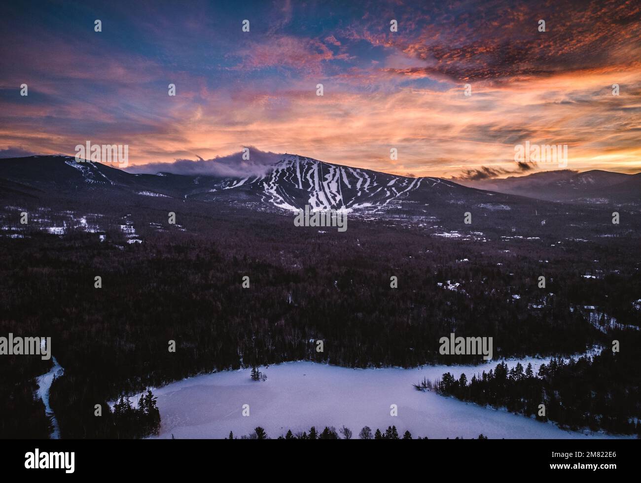 Clouds shroud the summit of Sugarloaf Mountain, Maine at sunset Stock ...