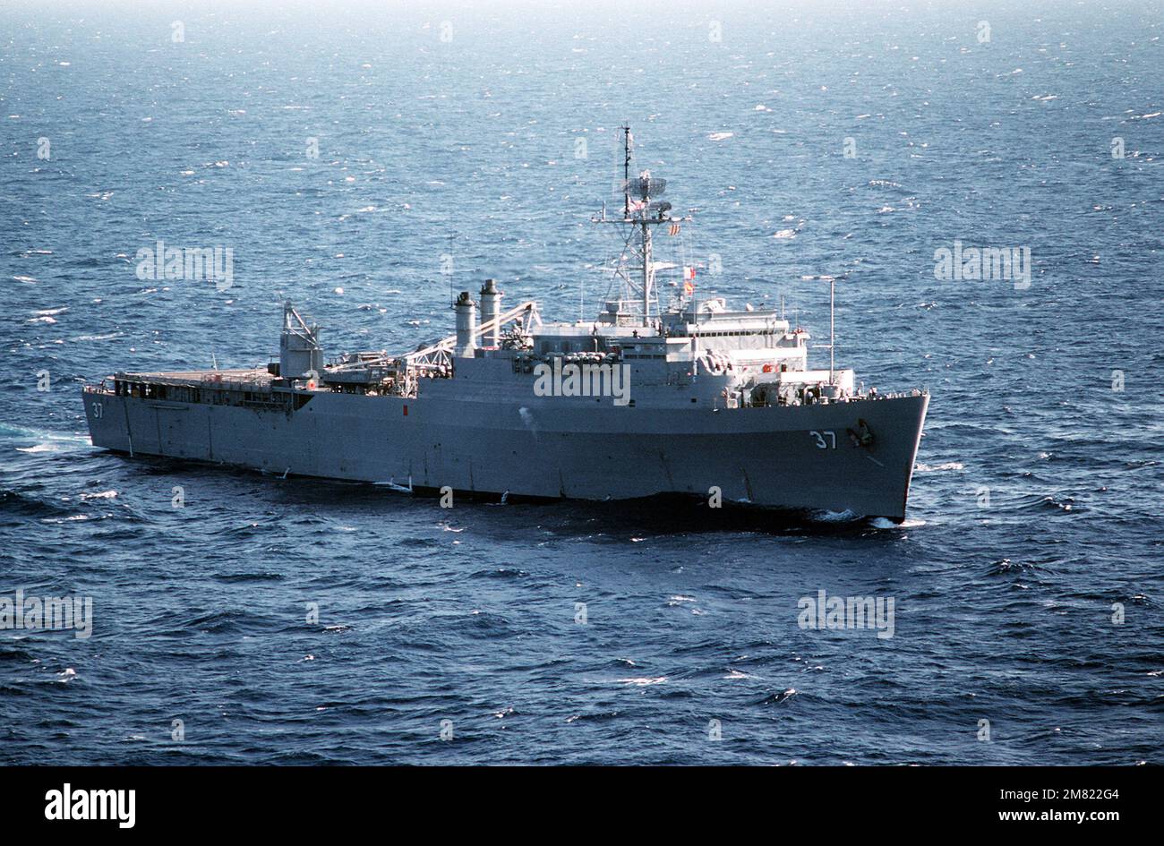 An elevated starboard bow view of the dock landing ship USS PORTLAND ...
