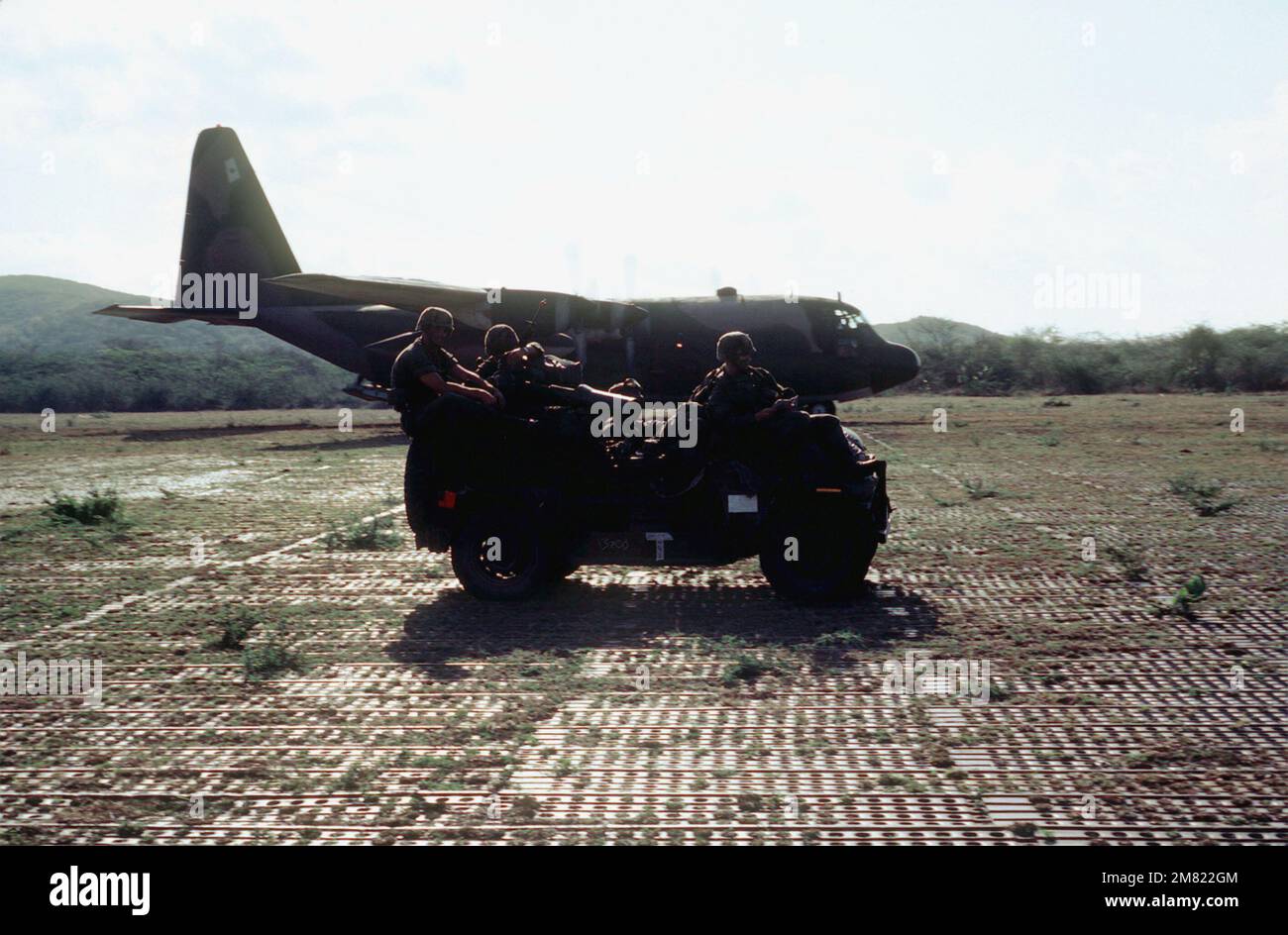 Members of the 82nd Airborne Division sit aboard an M151A1 light ...
