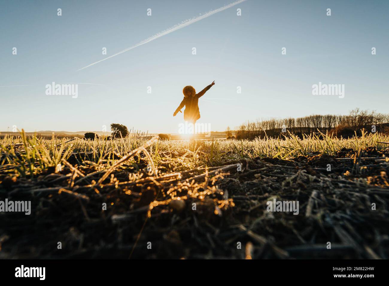 happy person in the field at sunrise Stock Photo - Alamy