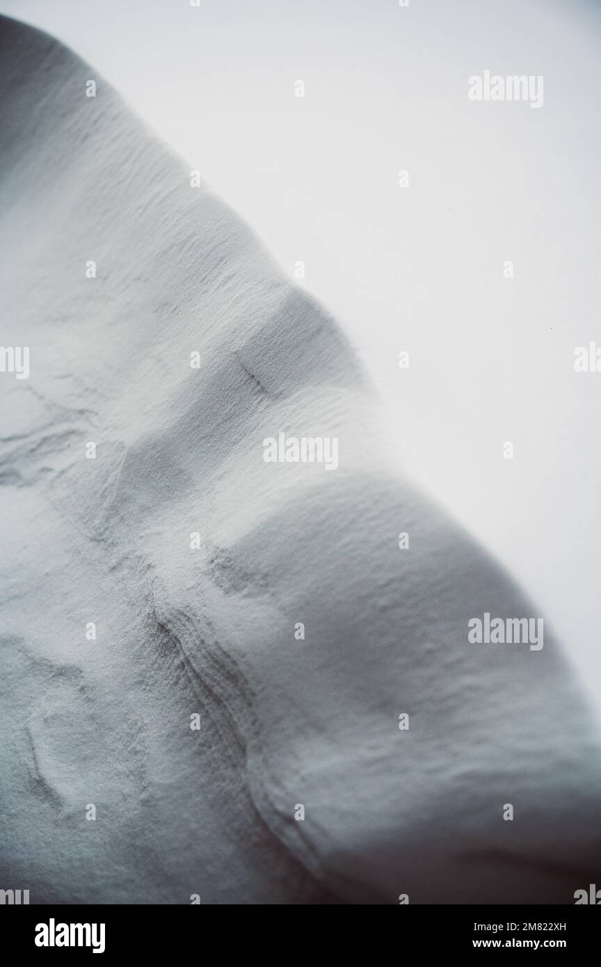 Close up of the clean snowy lines of a snow drift on a winter day Stock ...