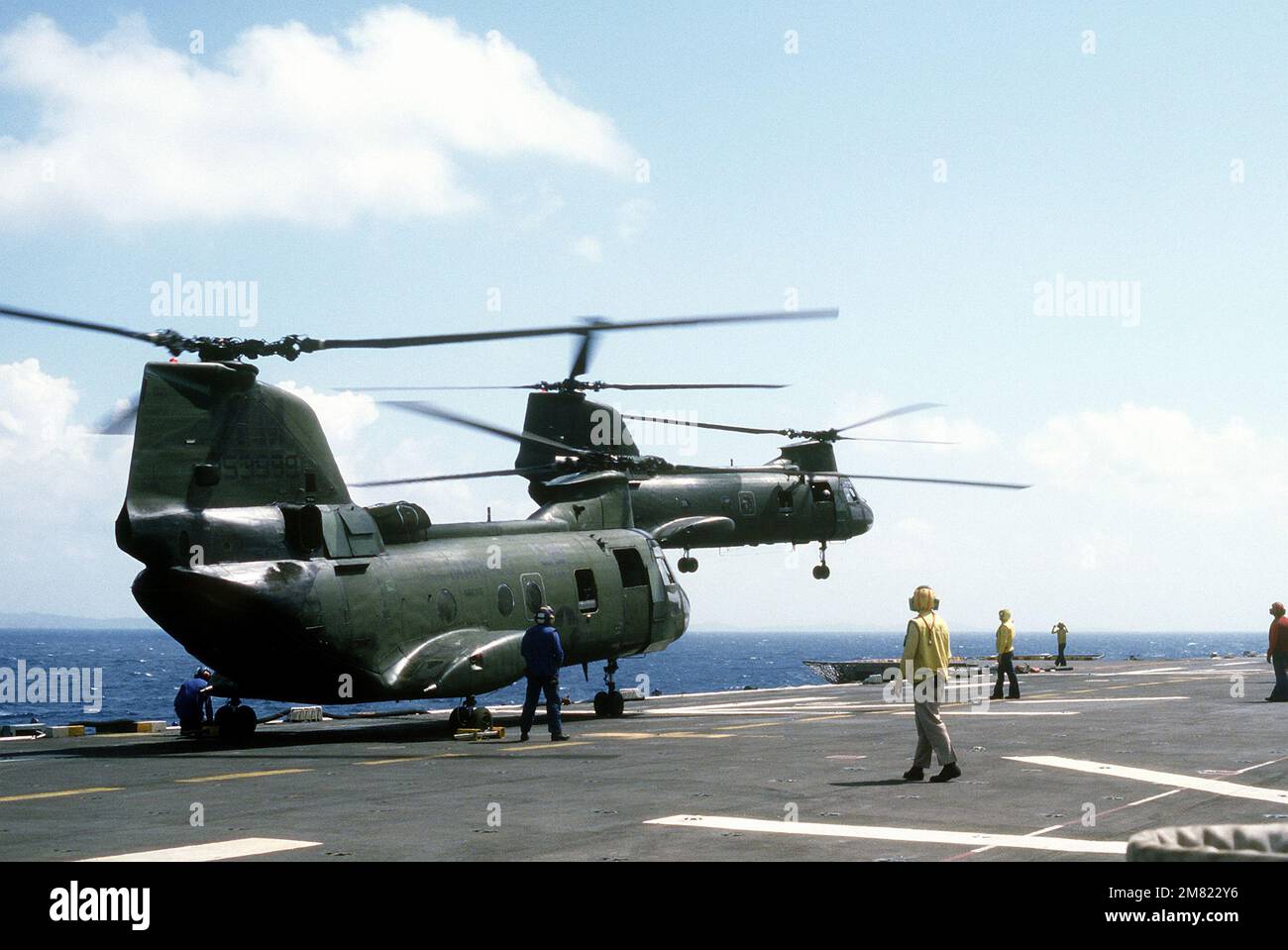 A right side view of two CH-46 Sea Knight helicopters as flight ...