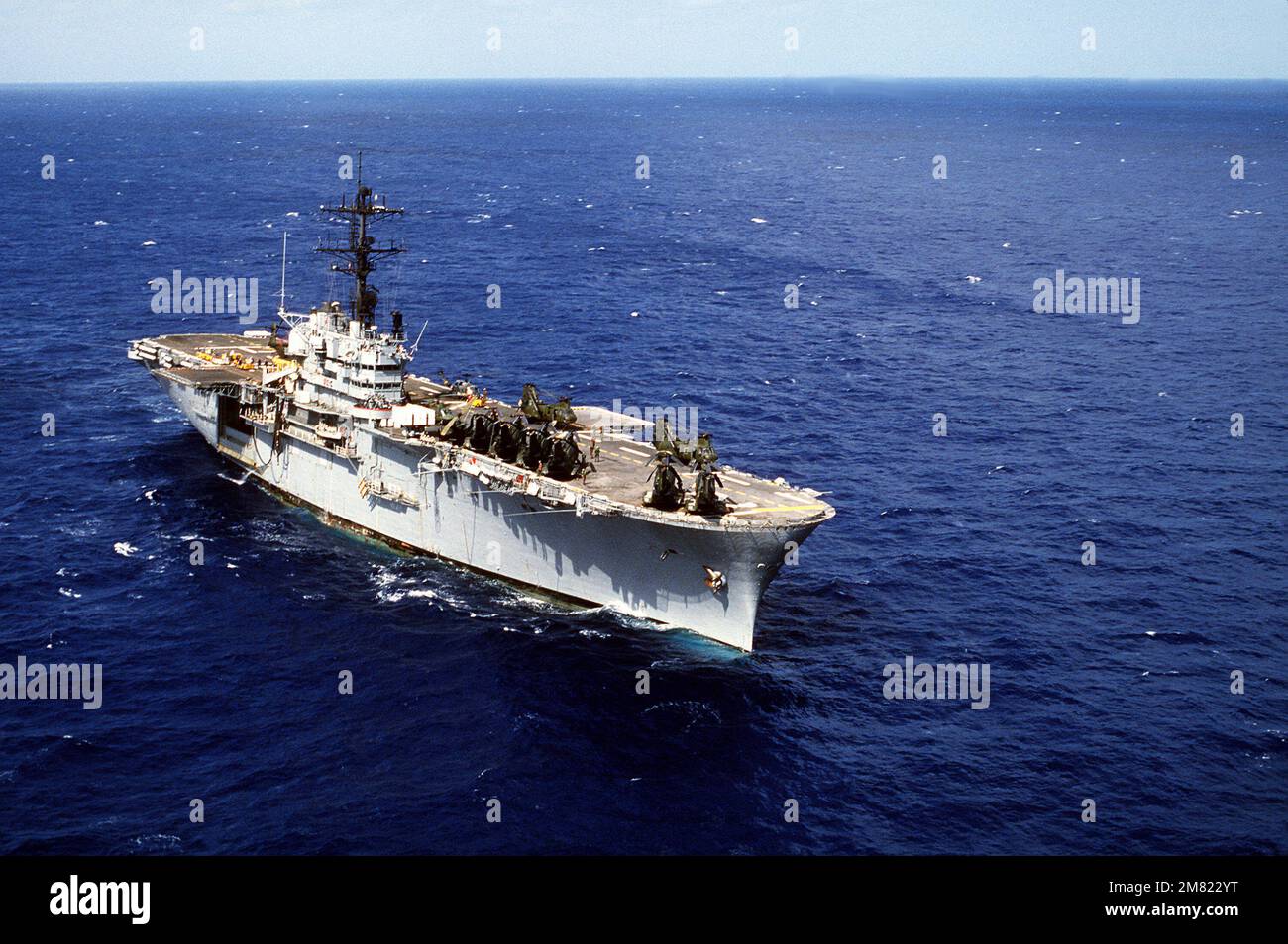 An aerial starboard bow view of the amphibious assault ship USS IWO ...