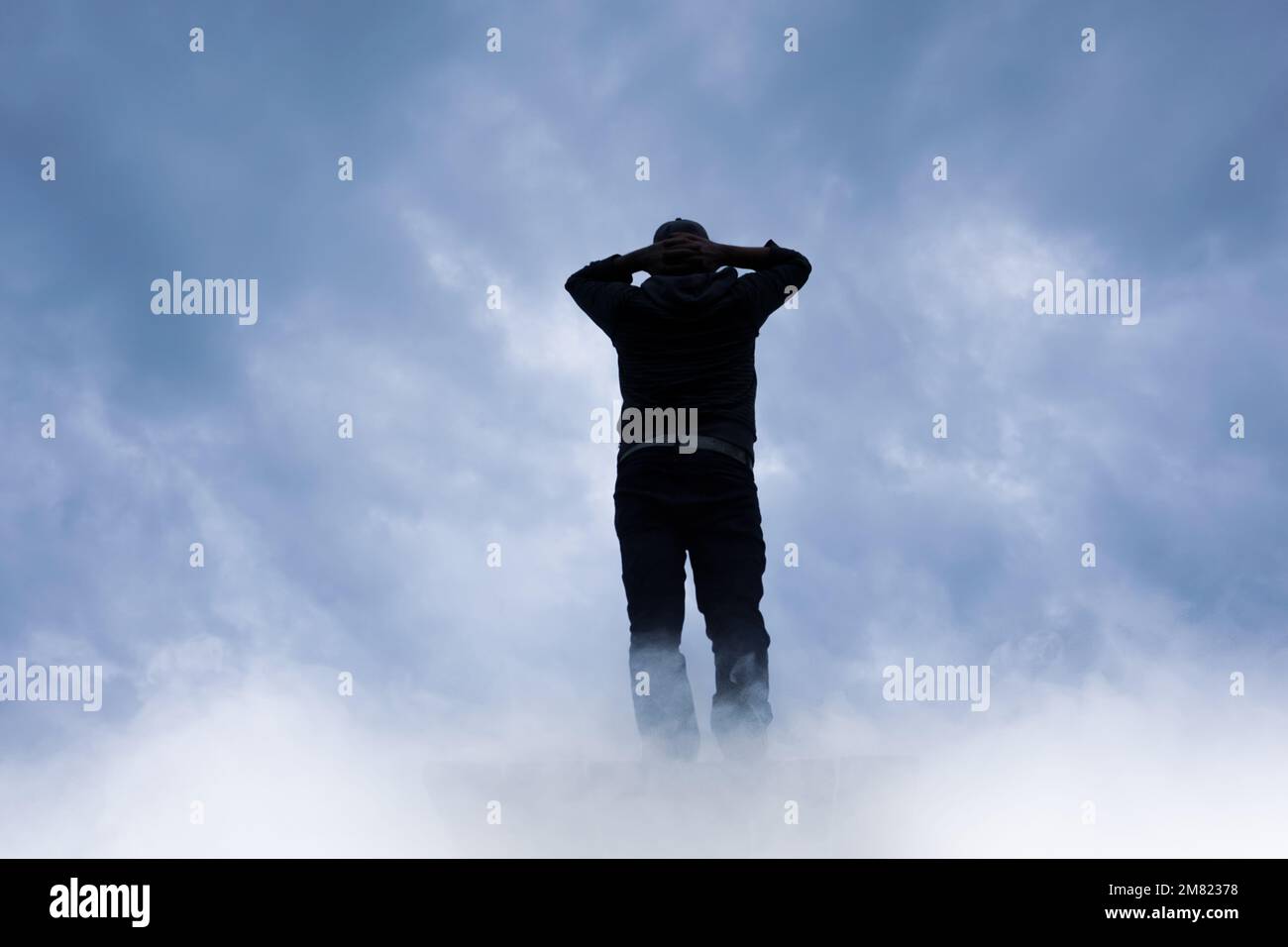 Man with clouds hi-res stock photography and images - Alamy