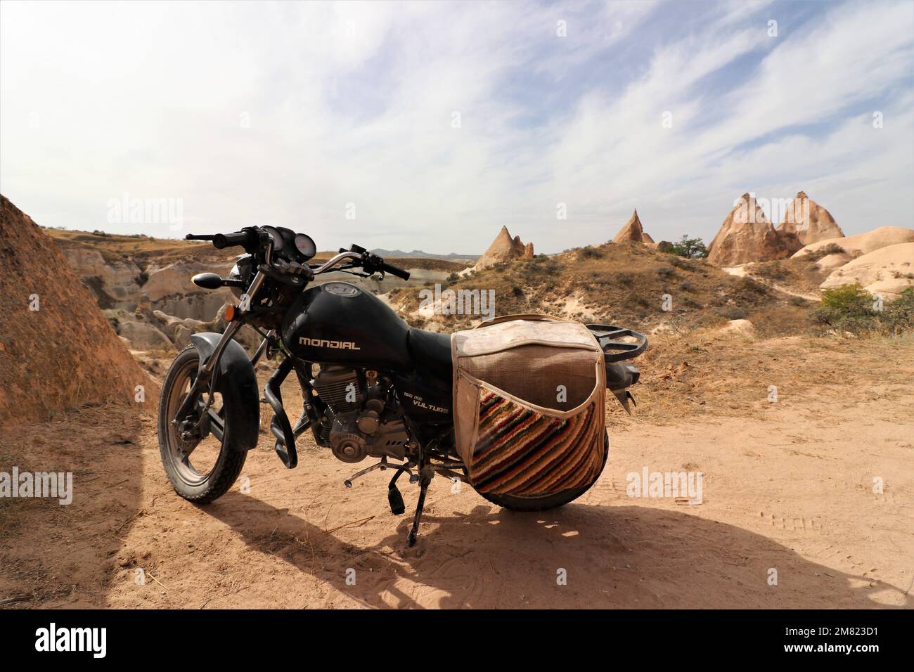 A custom built motorcycle is the means of transportation for villagers ...