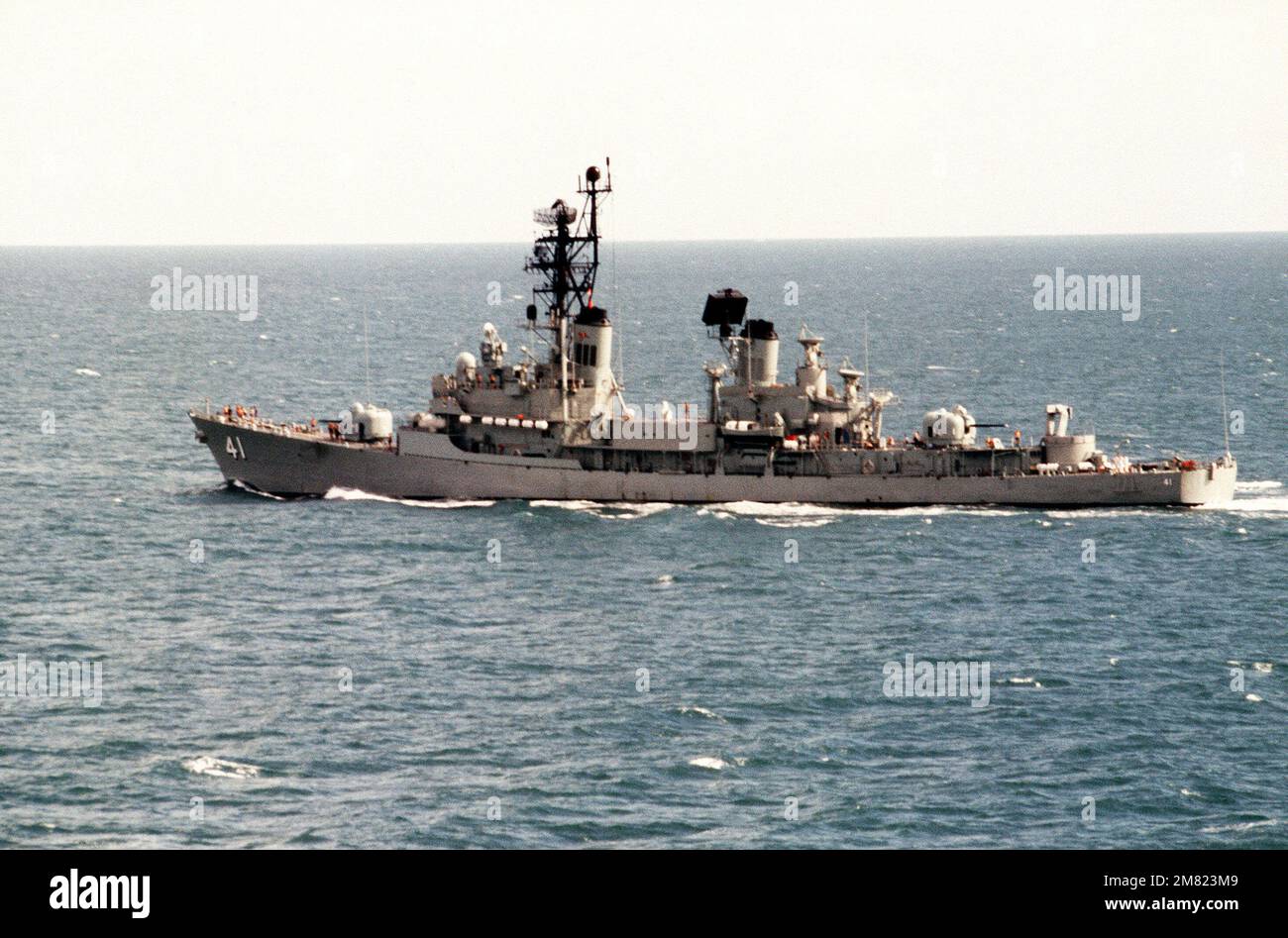 An aerial port side view of the Australian destroyer HMAS BRISBANE (D ...