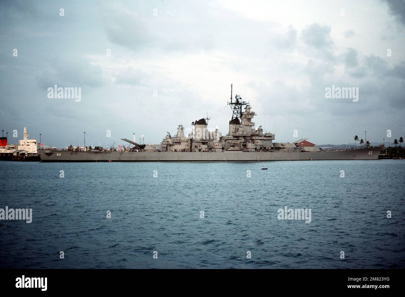 A starboard beam view of the battleship USS NEW JERSEY (BB 62) moored ...