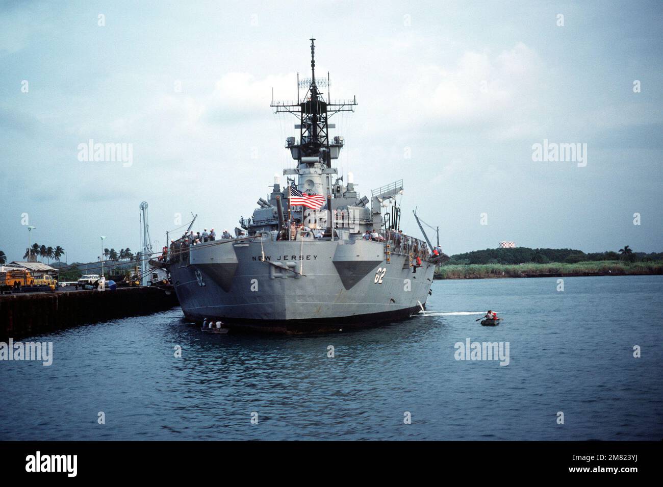 A stern view of the battleship USS NEW JERSEY (BB 62) moored at Colon ...