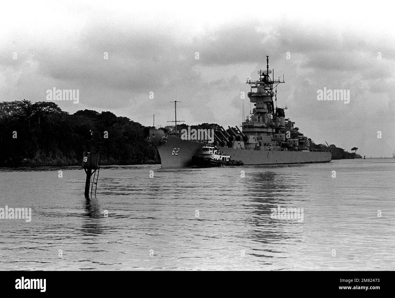 Port bow view of the battleship USS NEW JERSEY (BB 62) approaching ...