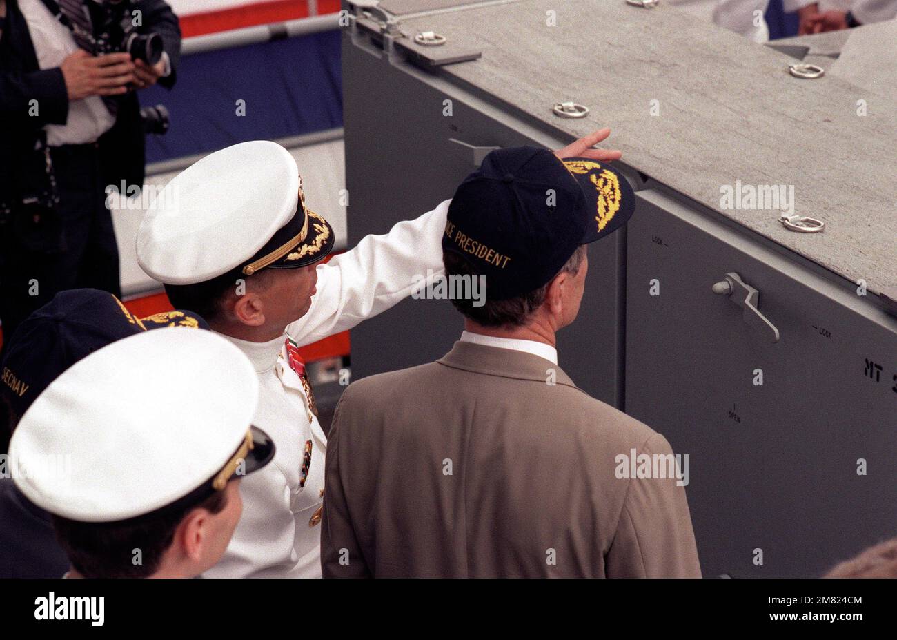 Captain Gerald E. Gneckow, ship's commanding officer, gives Vice ...
