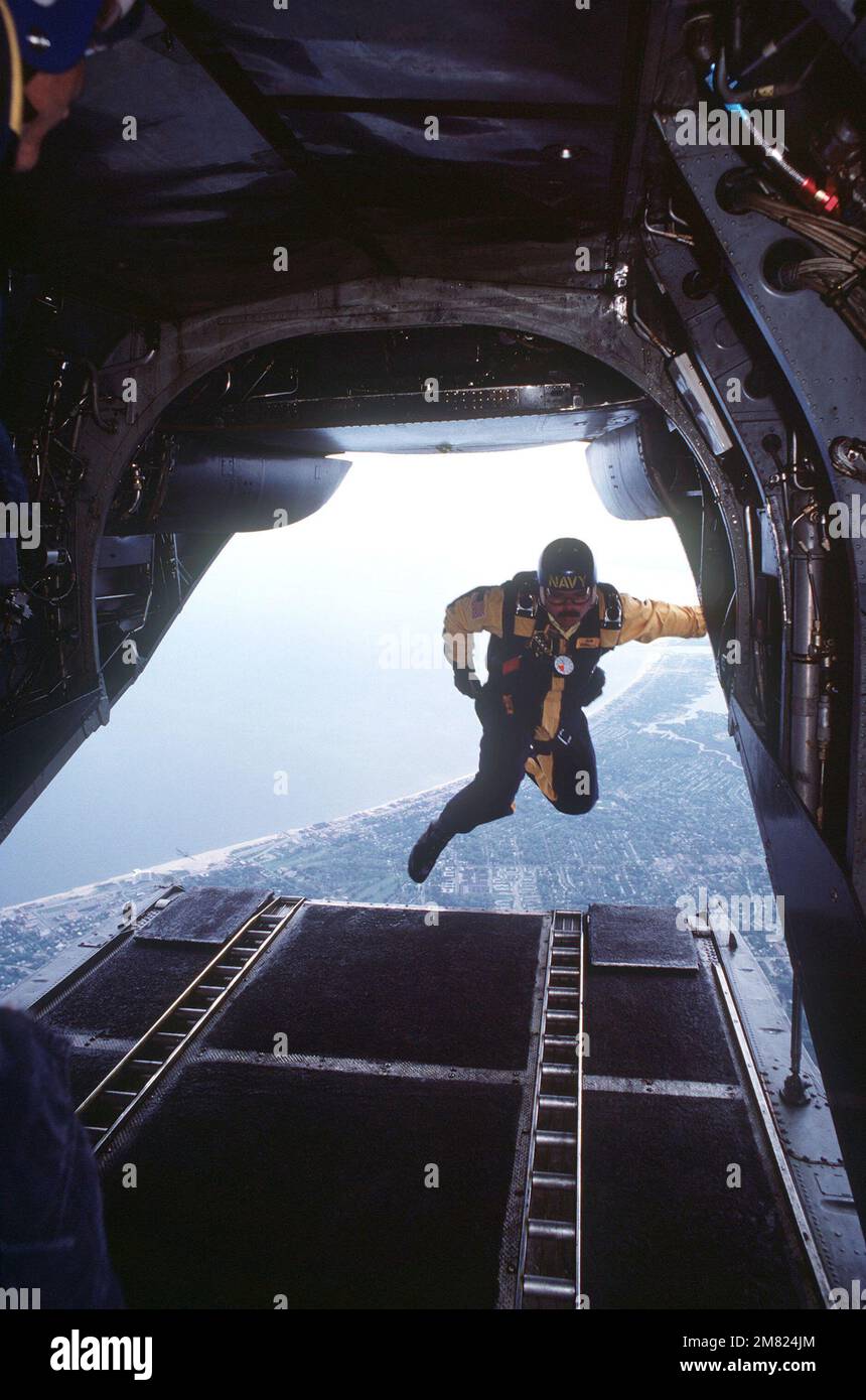 CHIEF Boatswains's Mate Jim Rowland jumps out of a CH-46 Sea Knight ...