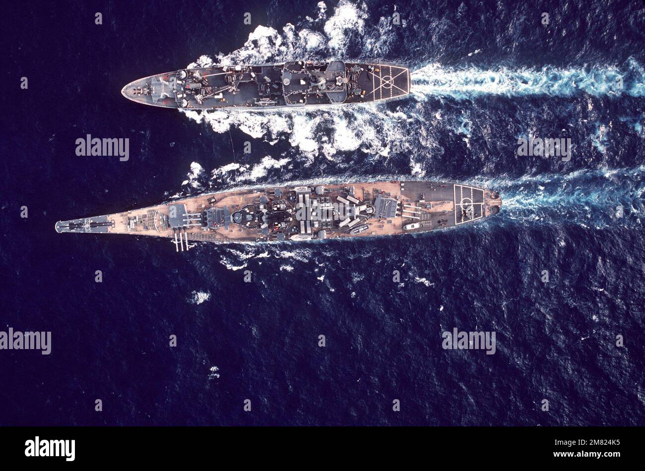 An aerial vertical view of the battleship USS IOWA (BB 61) receiving ...