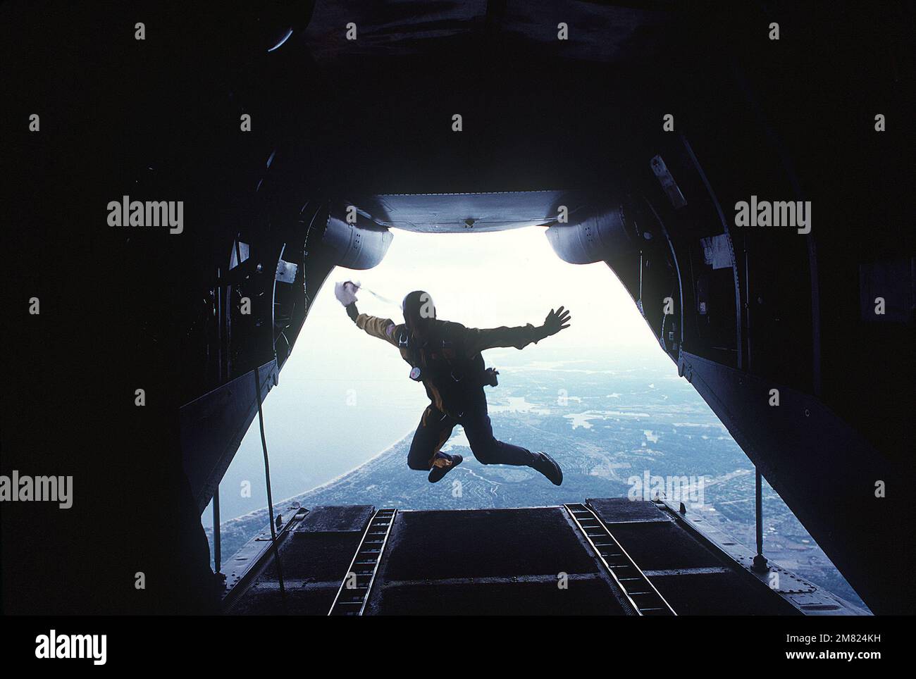Hull Maintenance Technician 2nd Class Dave Baudoin jumps out of a CH-46 ...