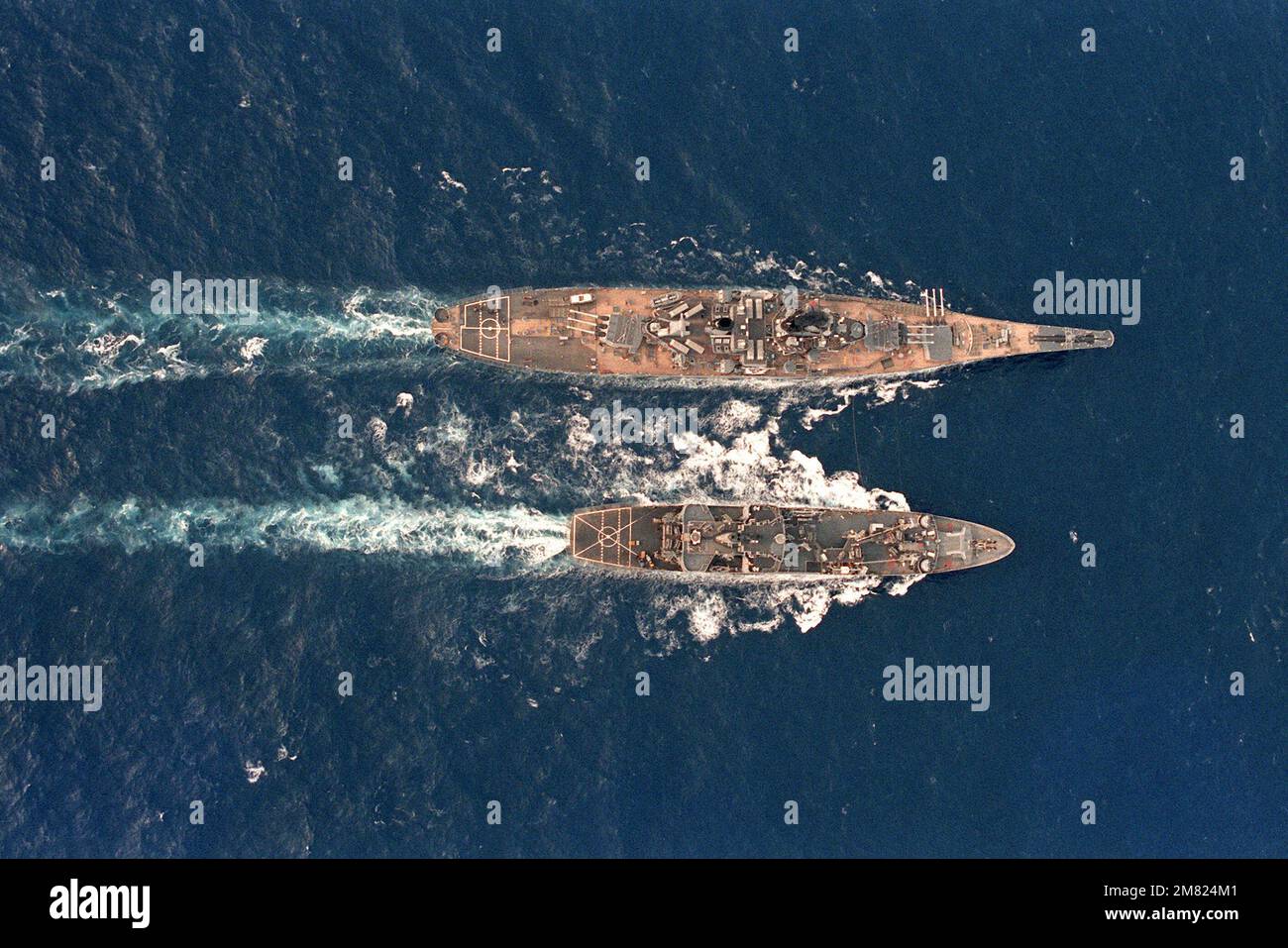 A vertical view of the battleship USS IOWA (BB-61) receiving supplies ...
